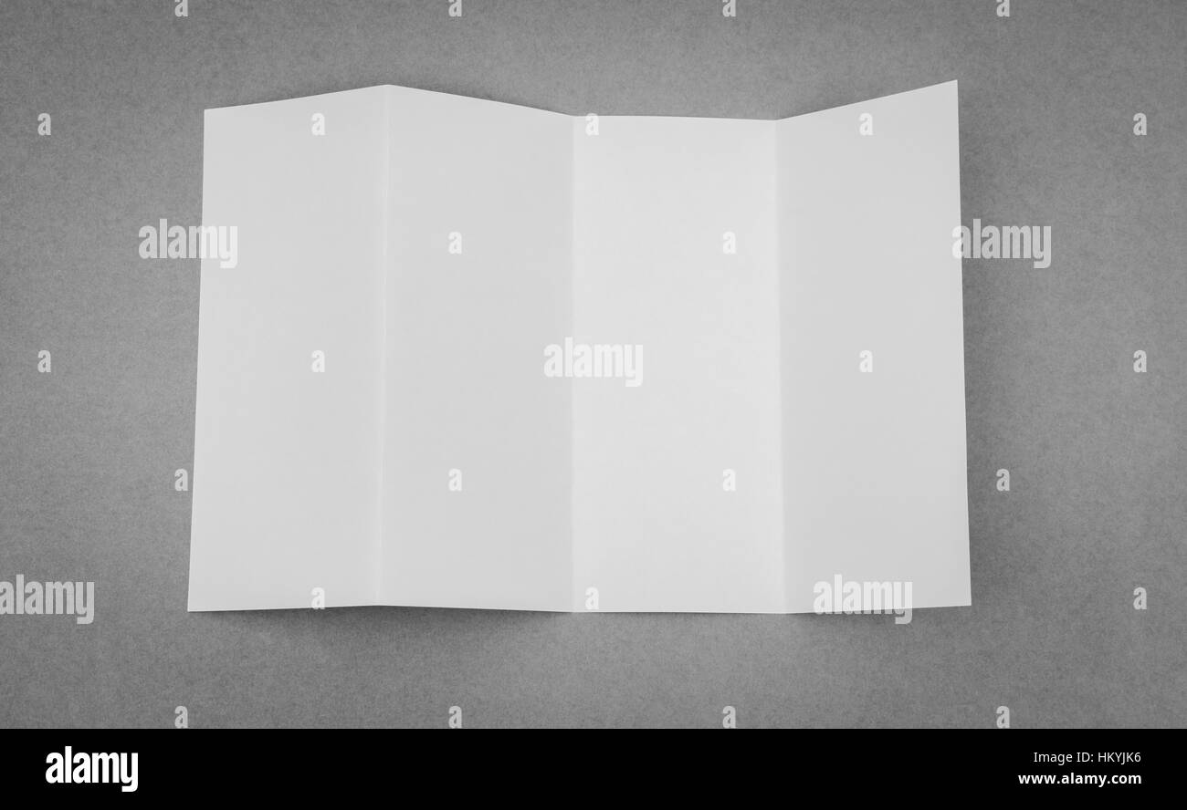 Four - fold white template paper on gray background Stock Photo - Alamy