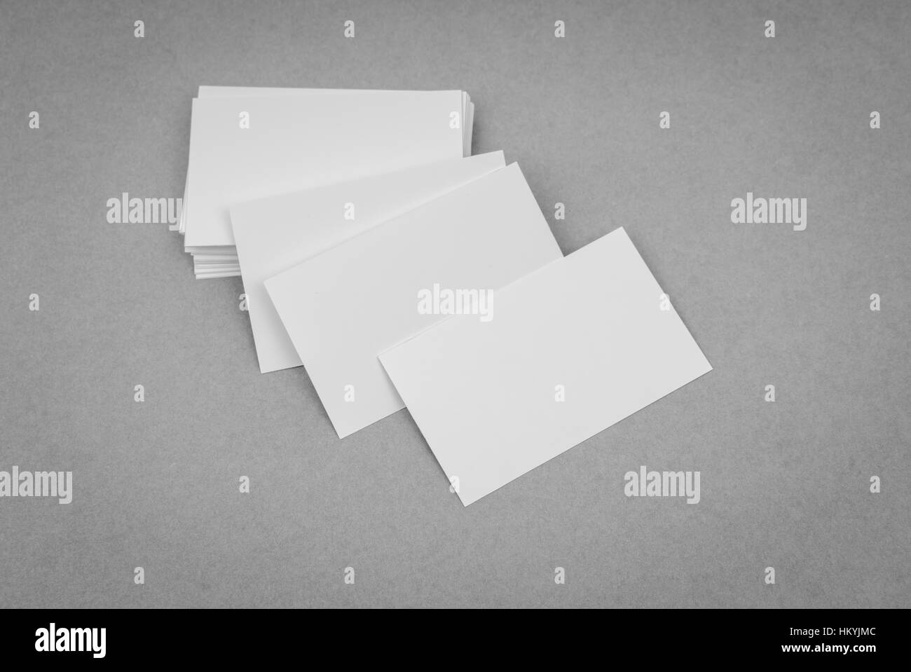 Business cards on gray background Stock Photo - Alamy