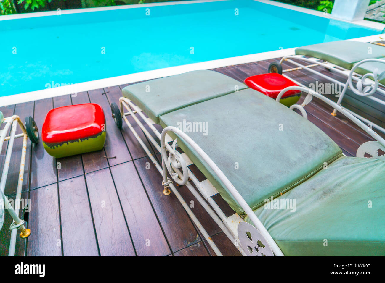 Swimming pool with relaxing seats Stock Photo - Alamy