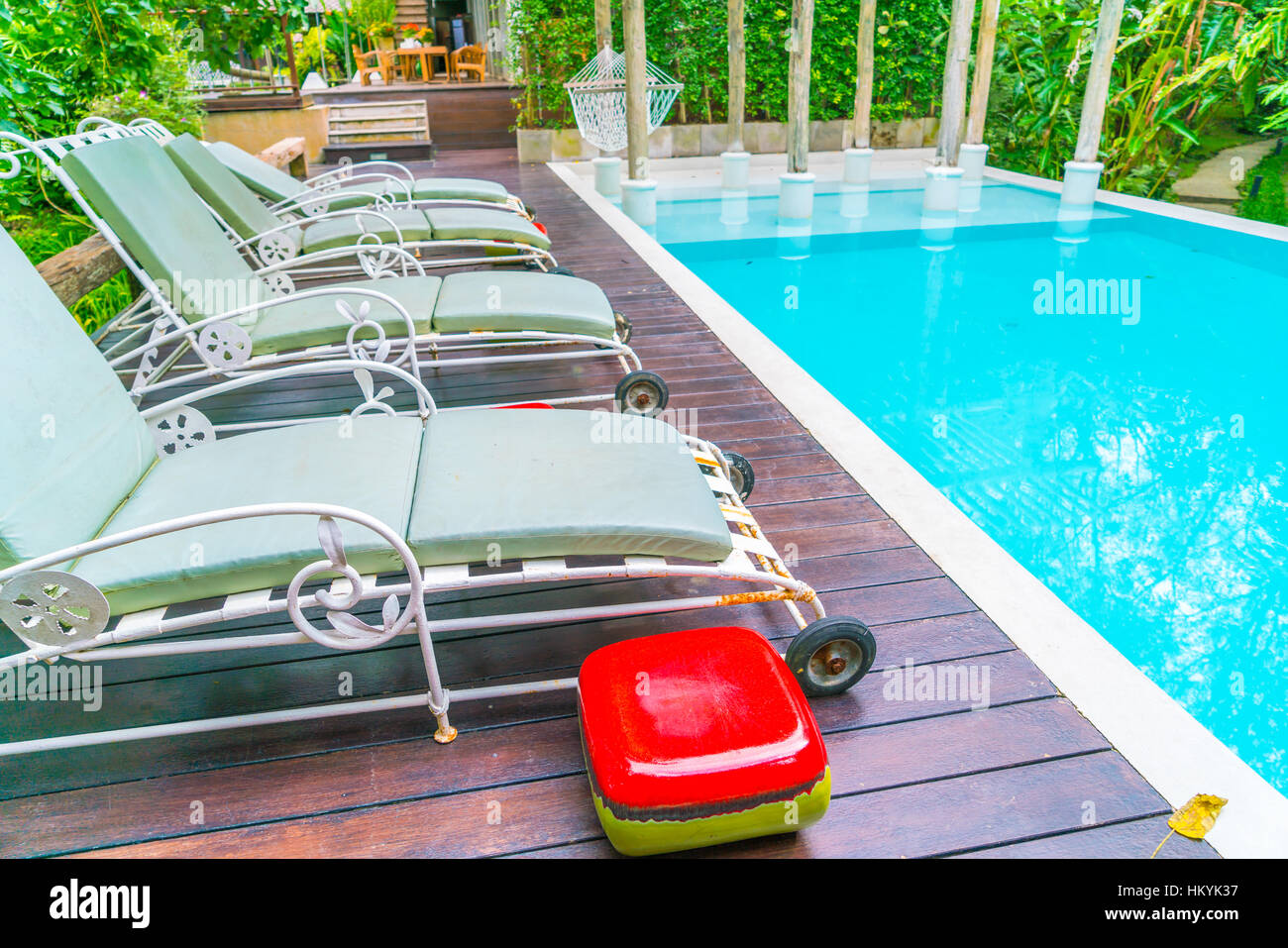 Swimming pool with relaxing seats Stock Photo - Alamy