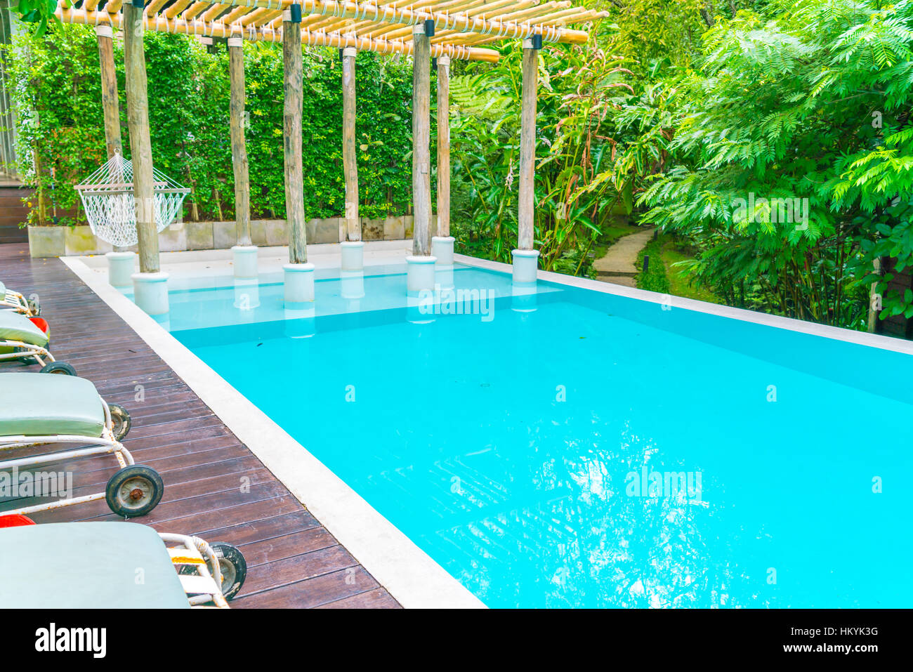 Swimming pool with relaxing seats Stock Photo - Alamy