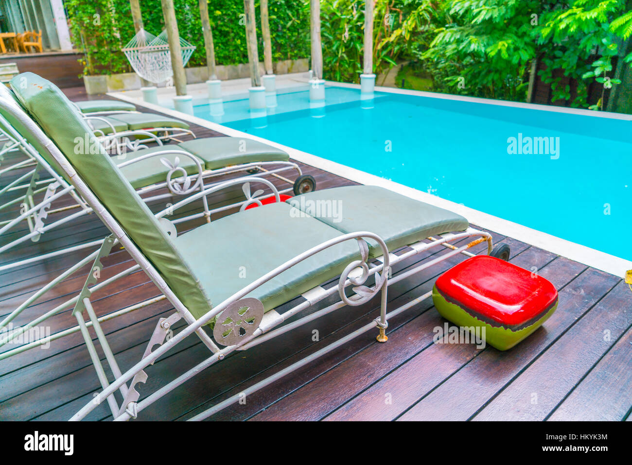 Swimming pool with relaxing seats Stock Photo - Alamy