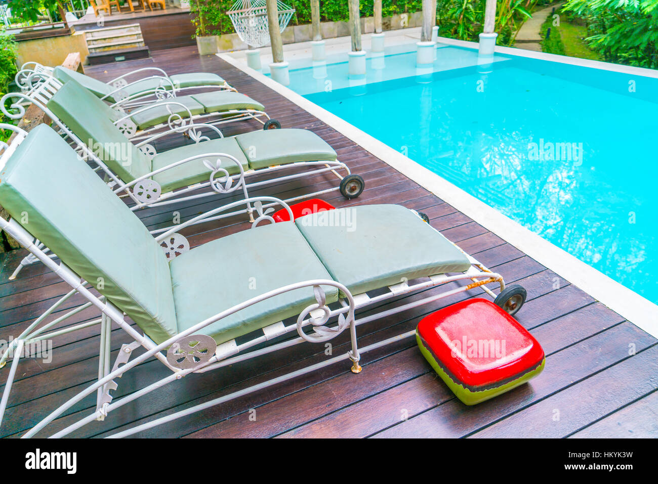 Swimming pool with relaxing seats Stock Photo - Alamy