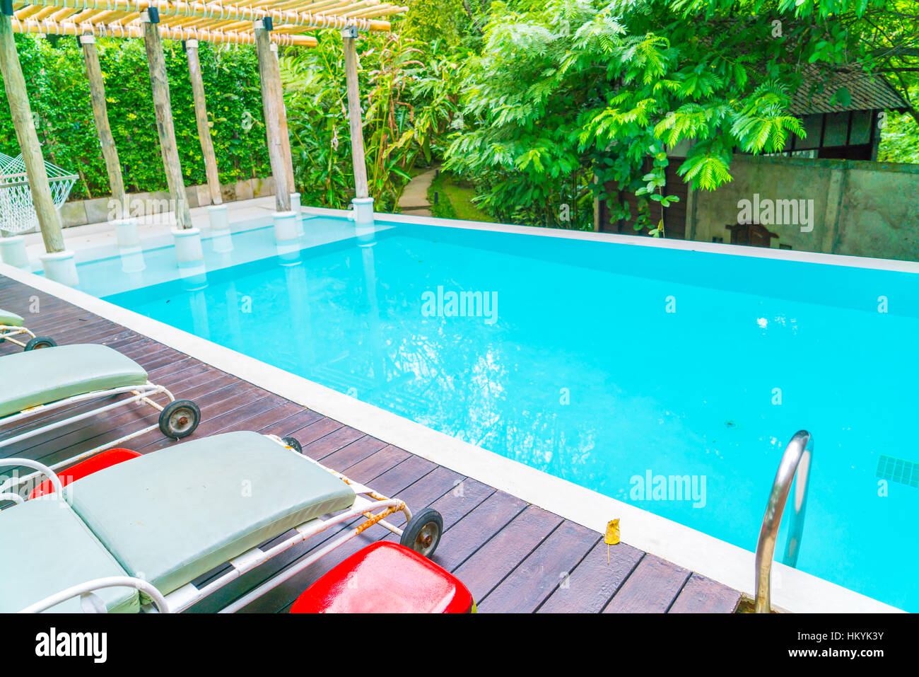 Swimming pool with relaxing seats Stock Photo - Alamy