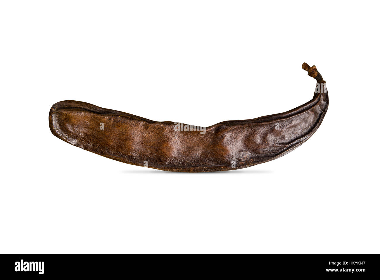 Raw fruits Carob on old juta background Stock Photo - Alamy