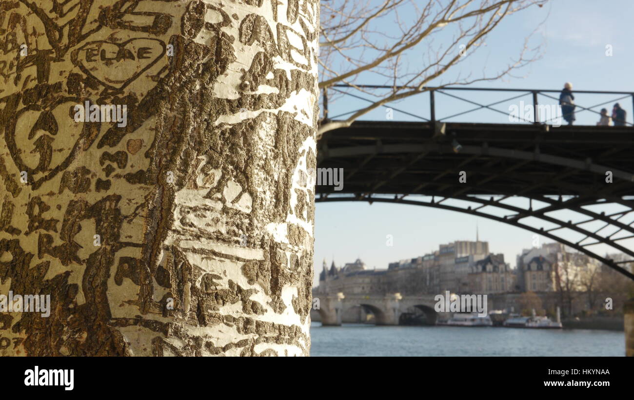 A bridge in Paris with people passing across it Stock Photo - Alamy