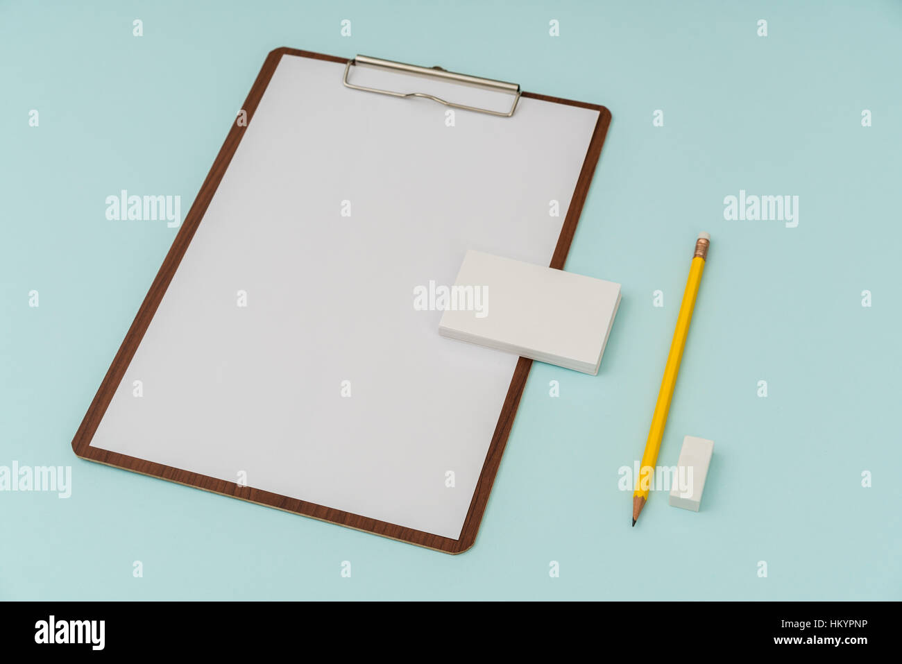 Clip board, paper and business card on blue background Stock Photo - Alamy