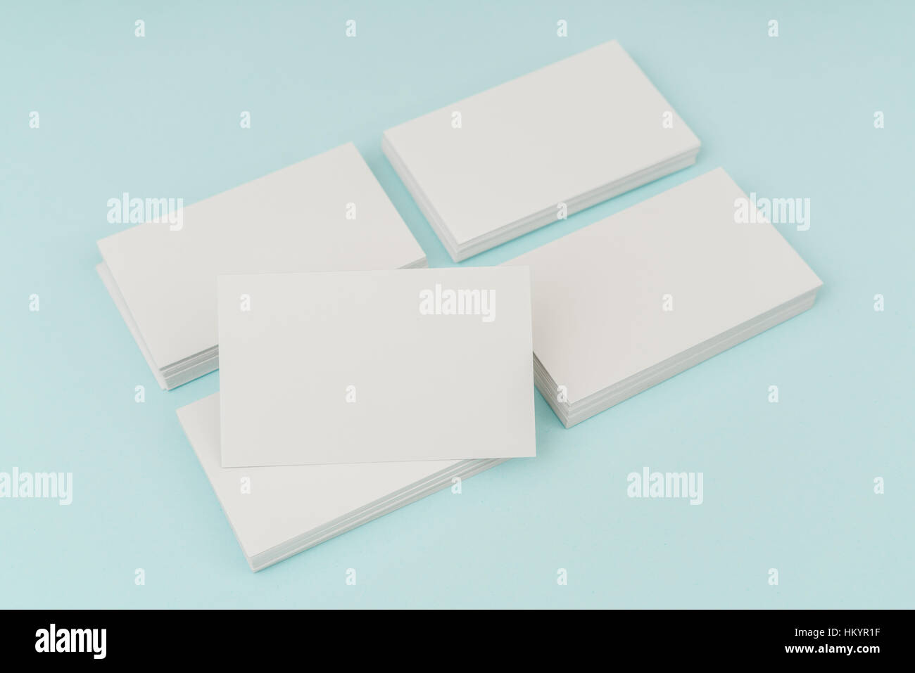 Blank business card on blue background Stock Photo - Alamy