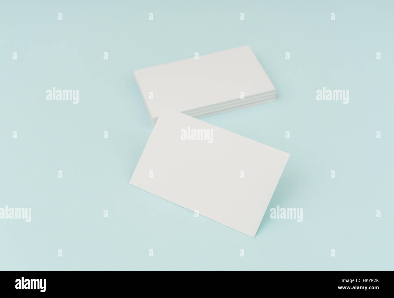 Blank business card on blue background Stock Photo - Alamy