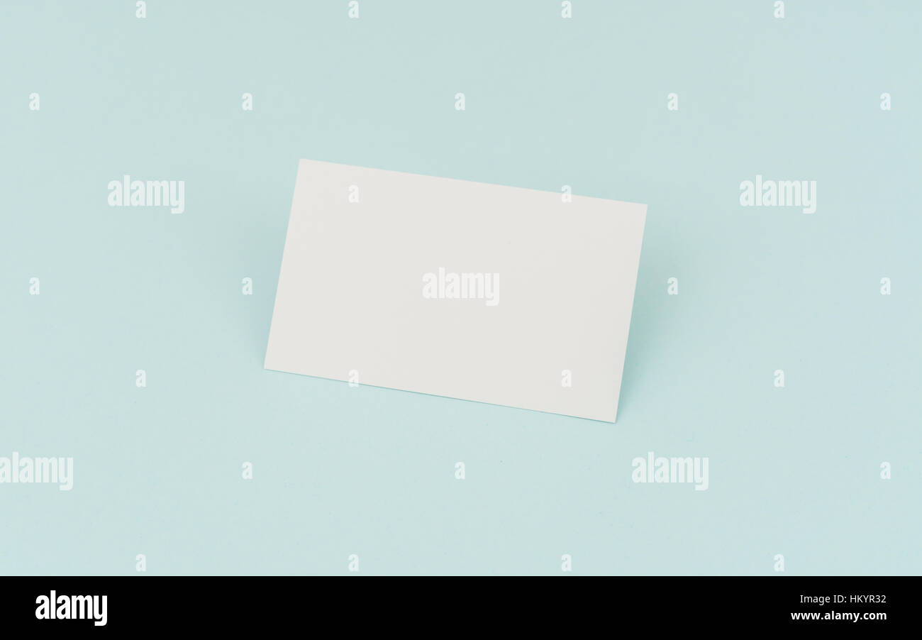 Blank business card on blue background Stock Photo - Alamy