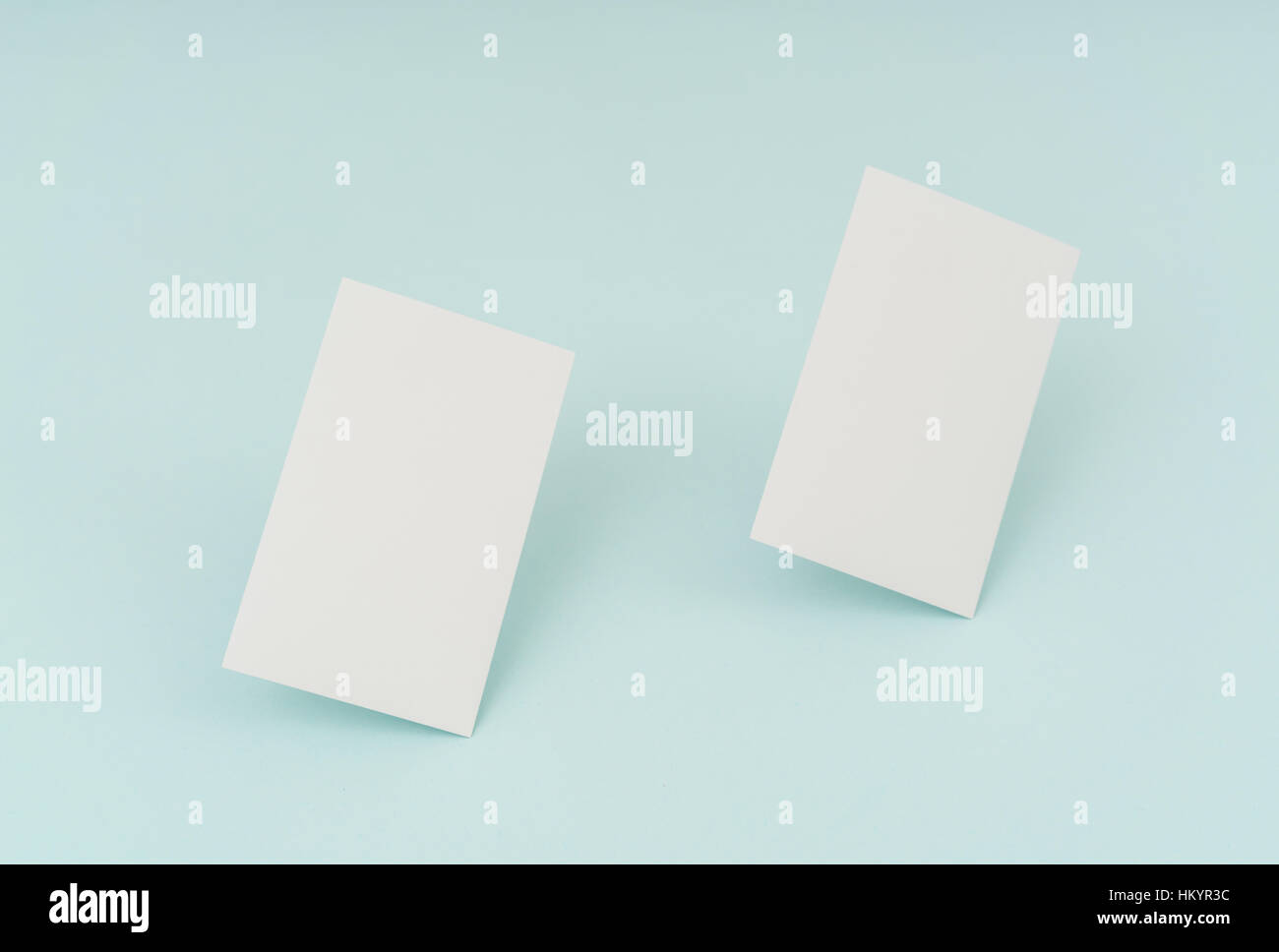 Blank business card on blue background Stock Photo - Alamy