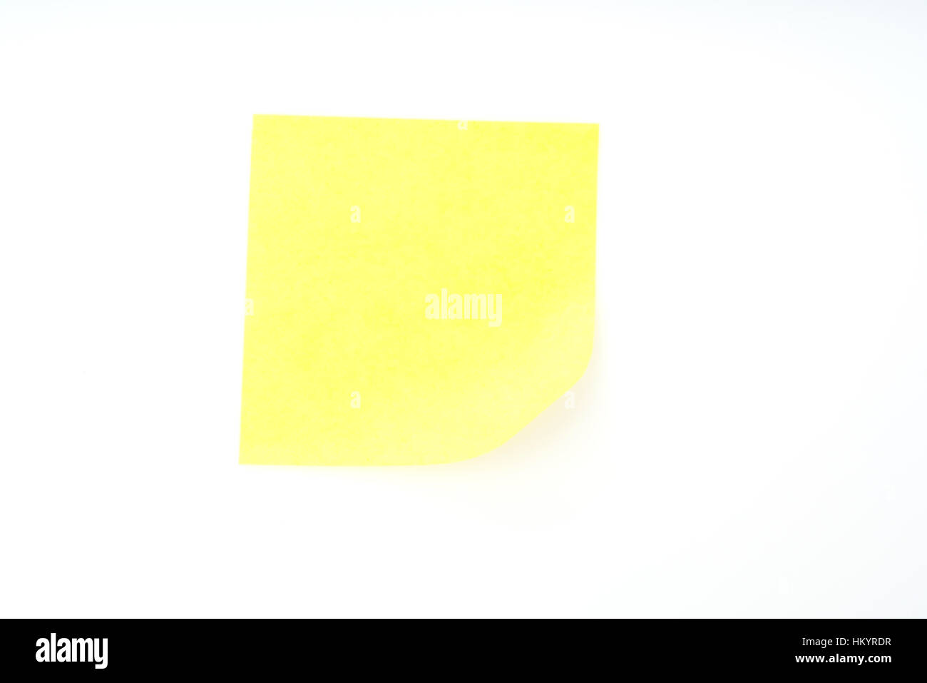 Yellow stick note on white background Stock Photo - Alamy