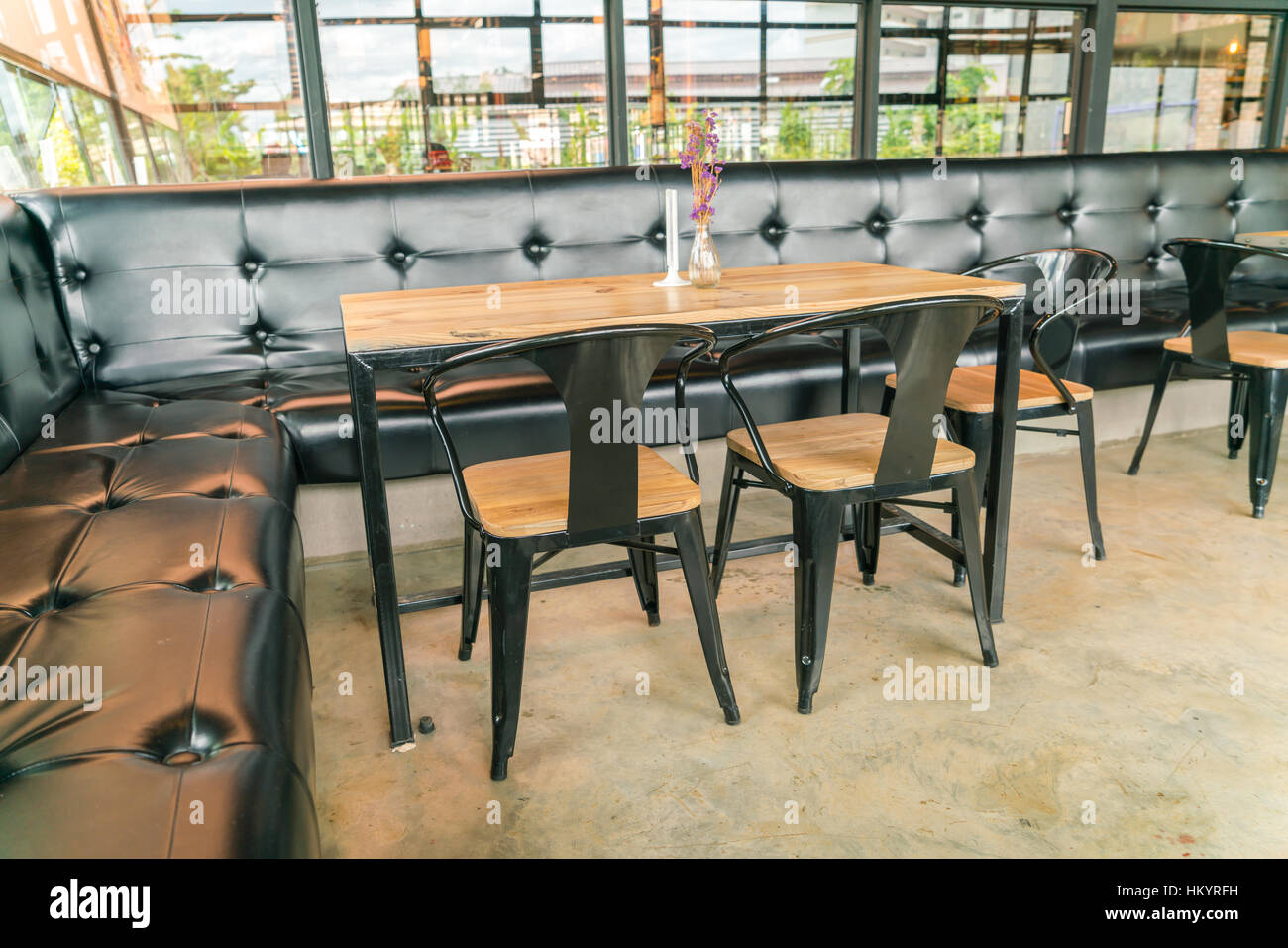 Tables and chairs in restaurant Stock Photo - Alamy