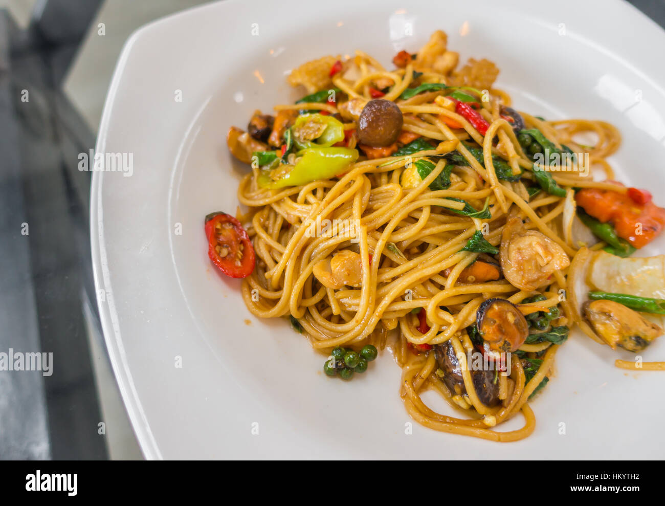 Spicy spaghetti with seafood Stock Photo - Alamy