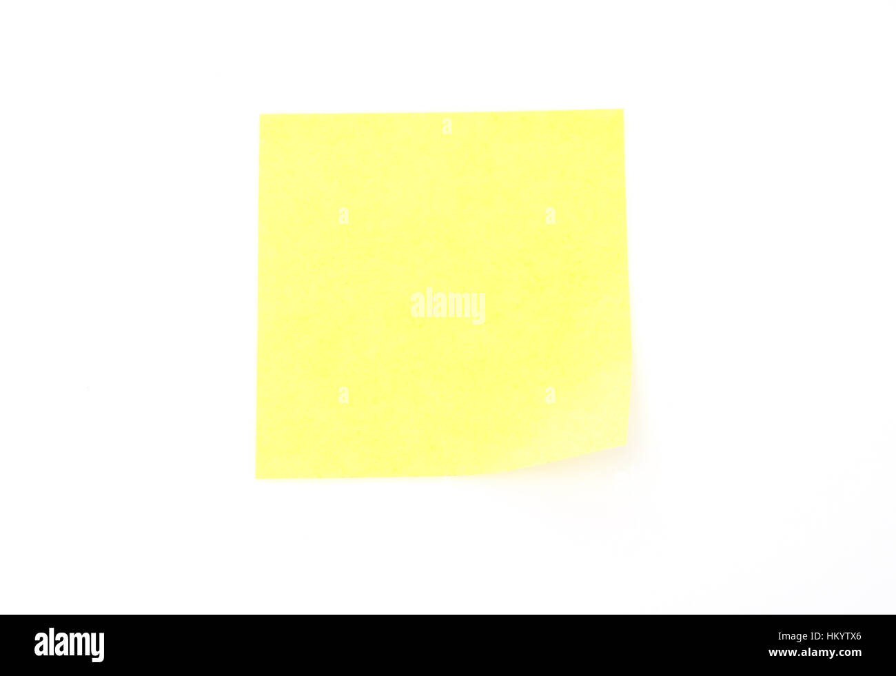 Yellow stick note on white background Stock Photo - Alamy