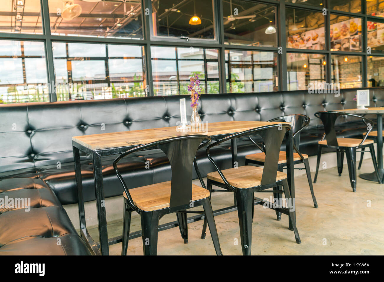 Tables and chairs in restaurant Stock Photo - Alamy