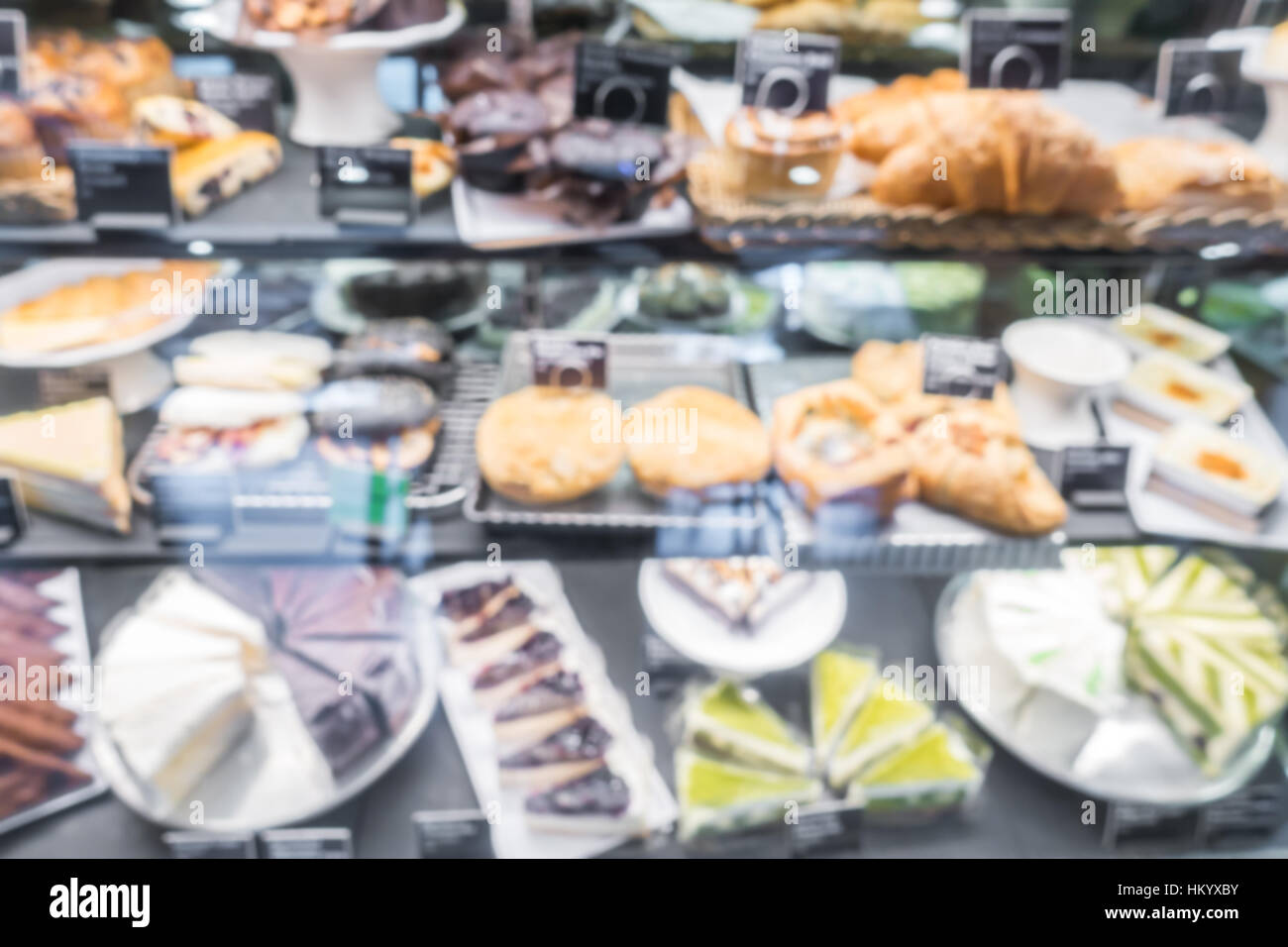 Abstract blur shop display window with variety of cakes Stock Photo - Alamy