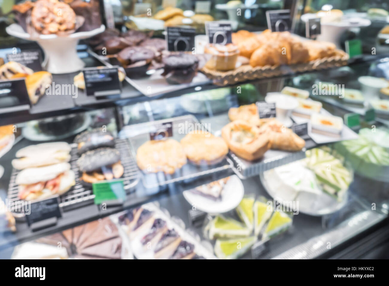 Abstract blur shop display window with variety of cakes Stock Photo - Alamy