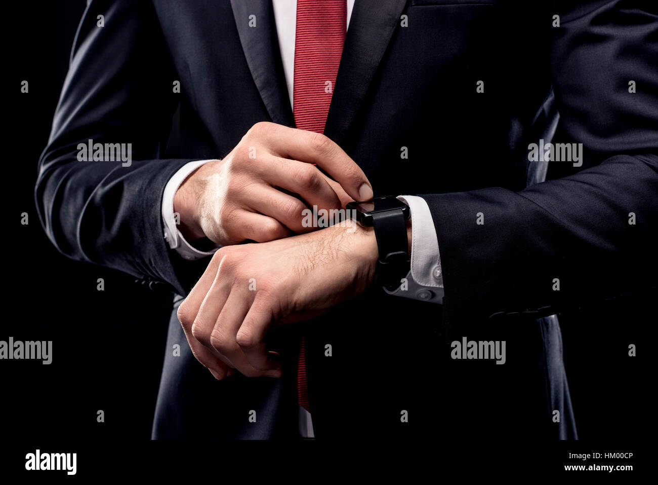 Businessman checking smartwatch Stock Photo - Alamy