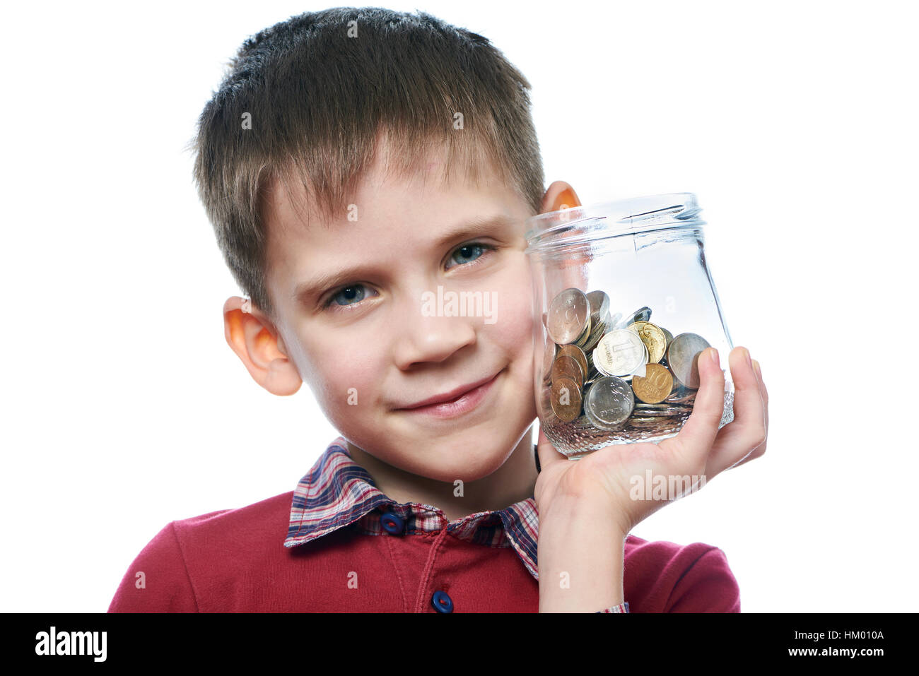 Beautiful little boy with glass jar of coins in his hands isolated ...