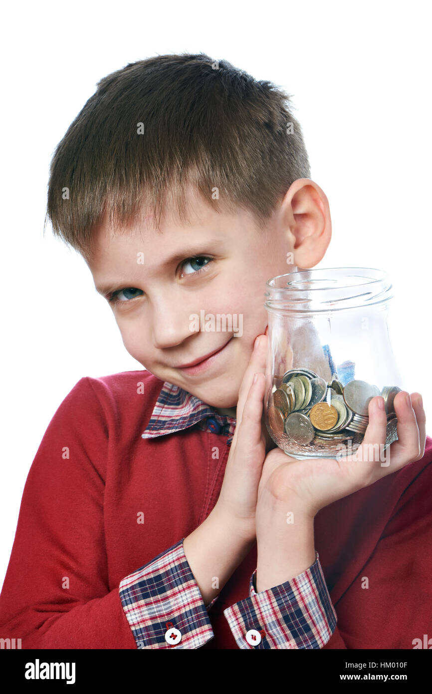 Beautiful little boy with glass jar of coins in his hands isolated ...