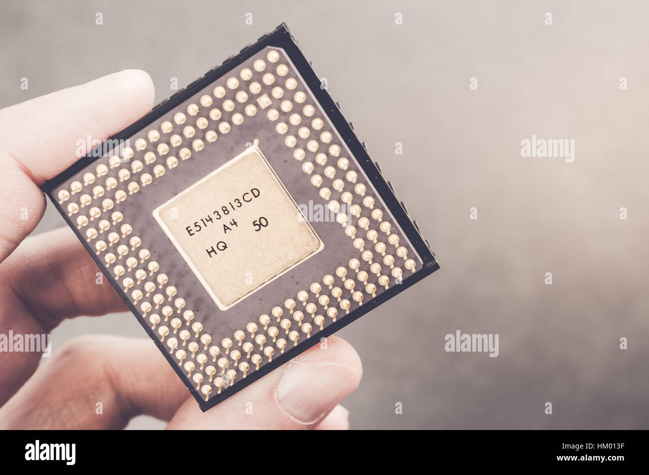 male hand holding microprocessor package - backside view Stock Photo ...