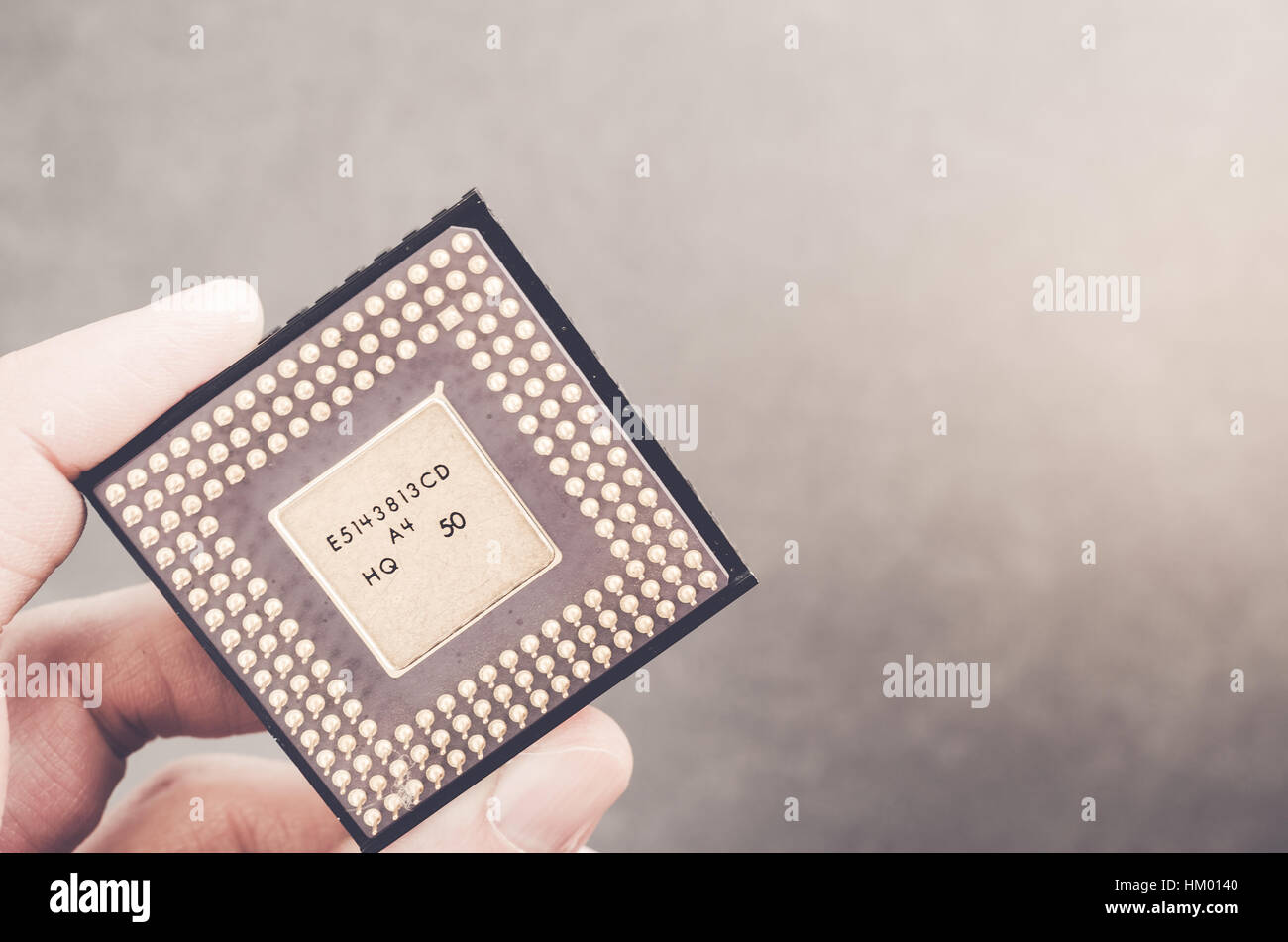 male hand holding microprocessor package - backside view Stock Photo ...