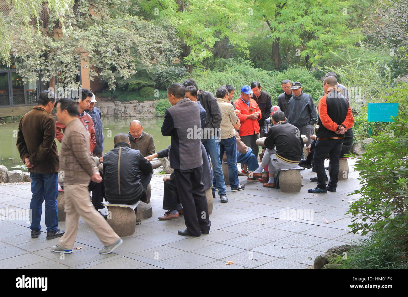 People play Chinese traditional board game at People’s park in Shanghai ...