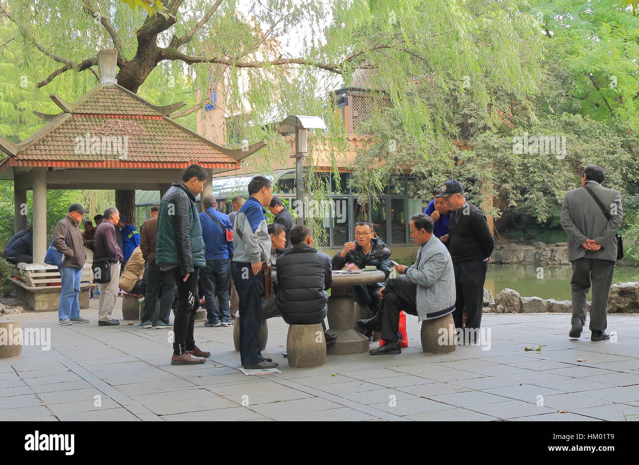 People play Chinese traditional board game at People’s park in Shanghai ...