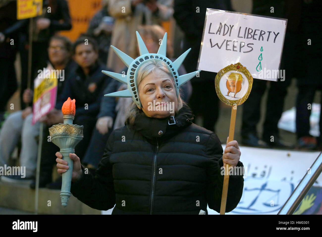 A woman dress as the Statue of Liberty during a protest in Glasgow ...