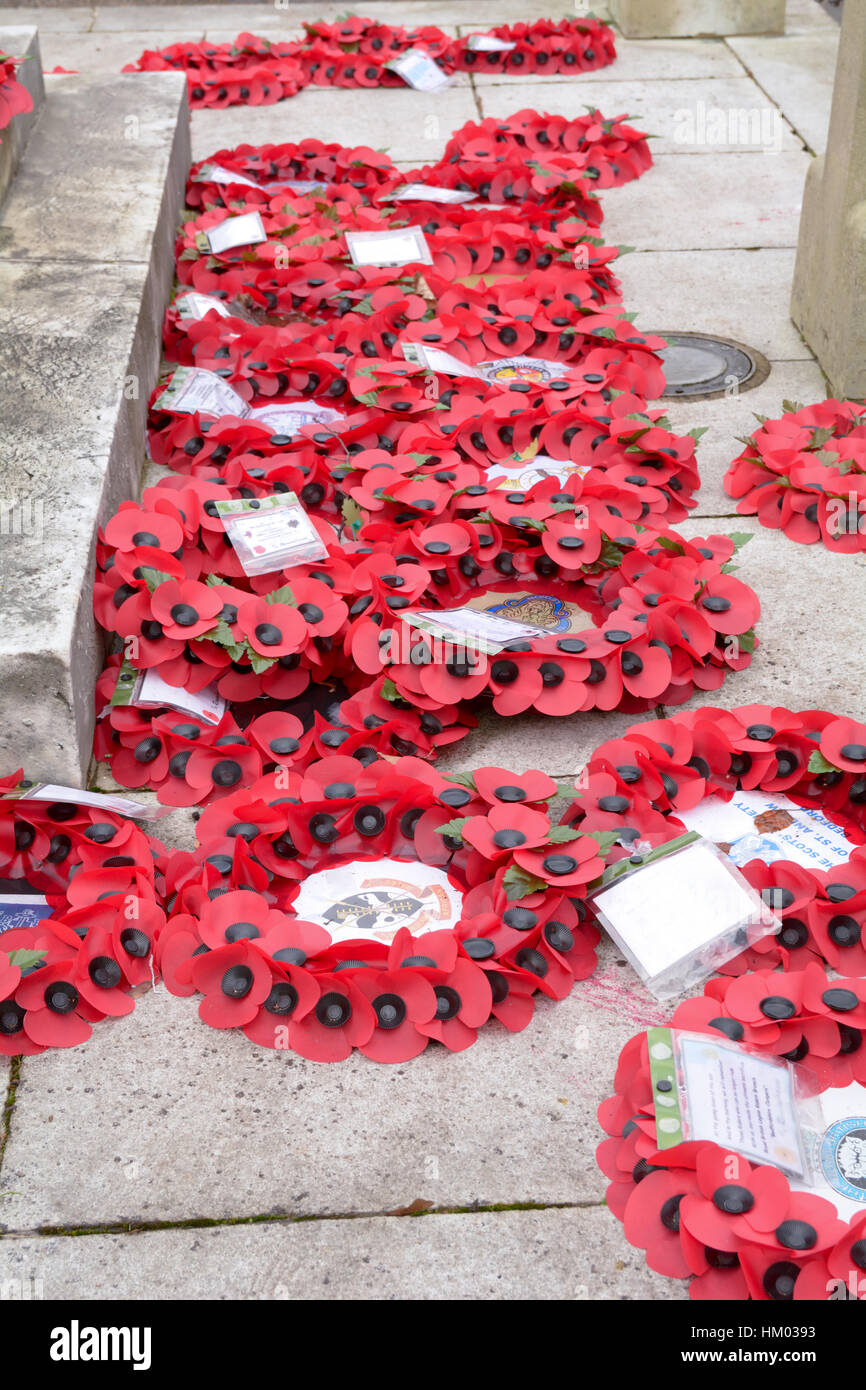 Poppy wreaths left as marks of respect at war memorial Stock Photo - Alamy