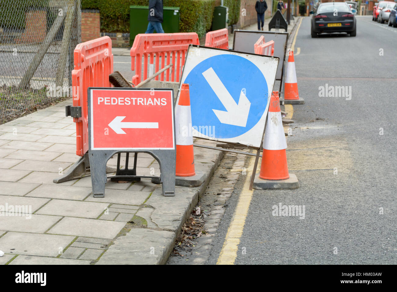Roadworks signs with direction arrows for vehicles and for pedestrians ...