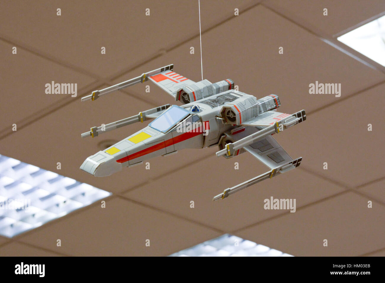 Star Wars X-Wing fighter model hanging from roof in shop Stock Photo ...