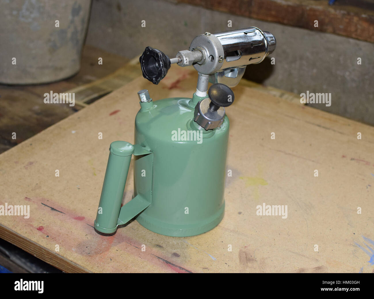 Blowtorch, general view. Blowtorch with a green tank Stock Photo - Alamy