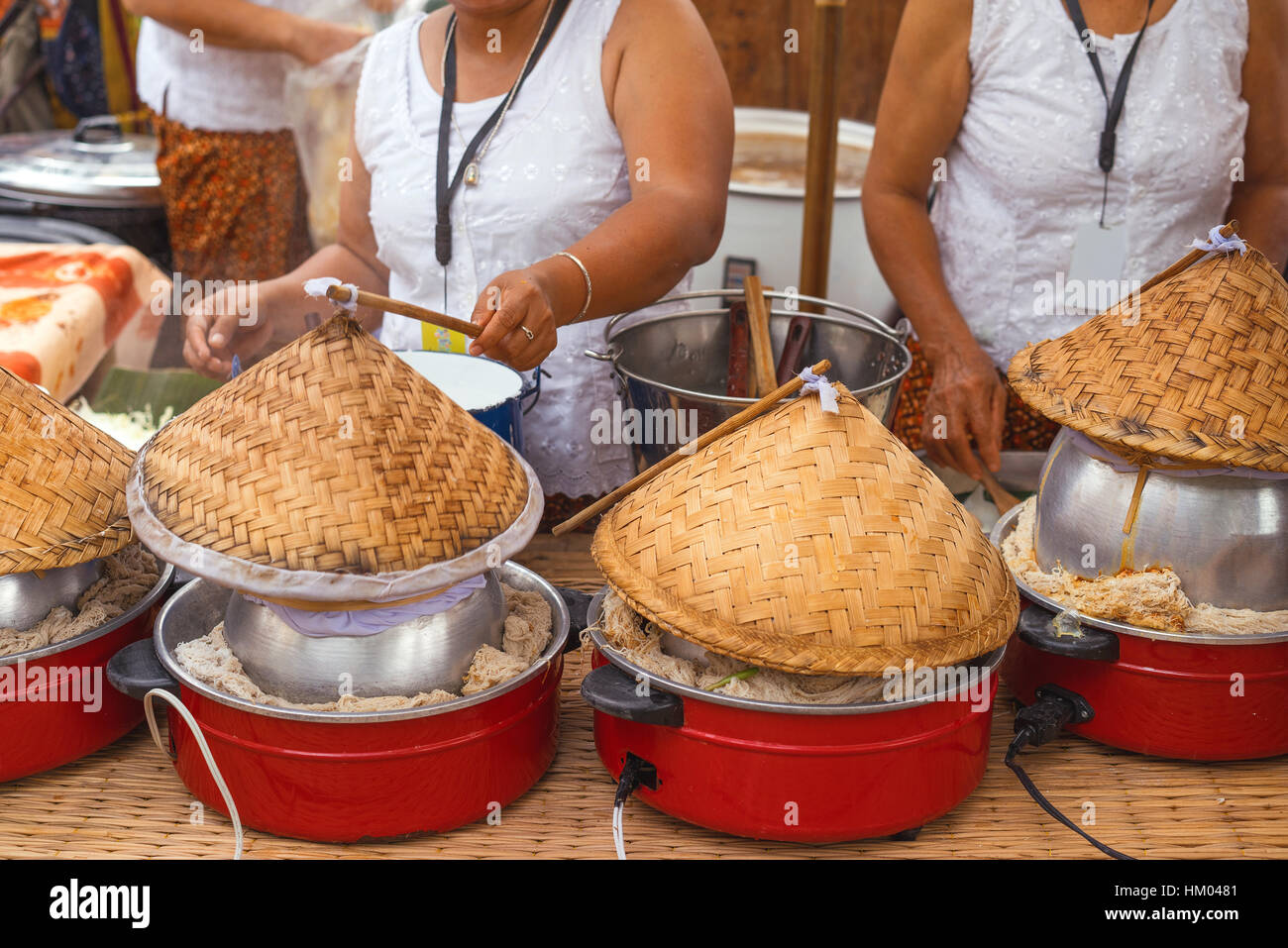 Women cook on asian street market Stock Photo - Alamy