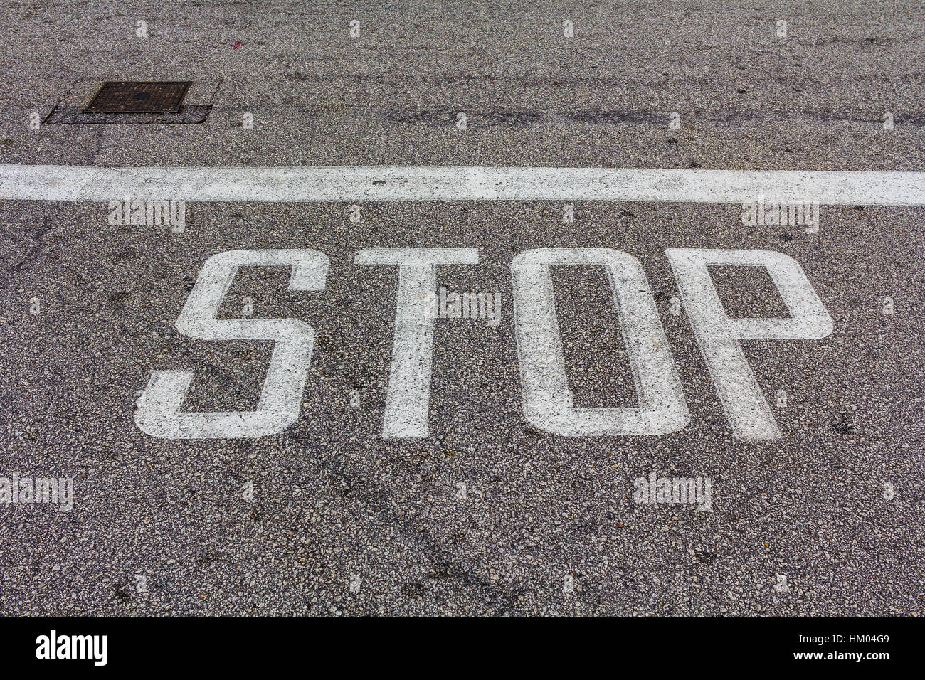 Word Stop written on an asphalt road, Top view on the road in ...