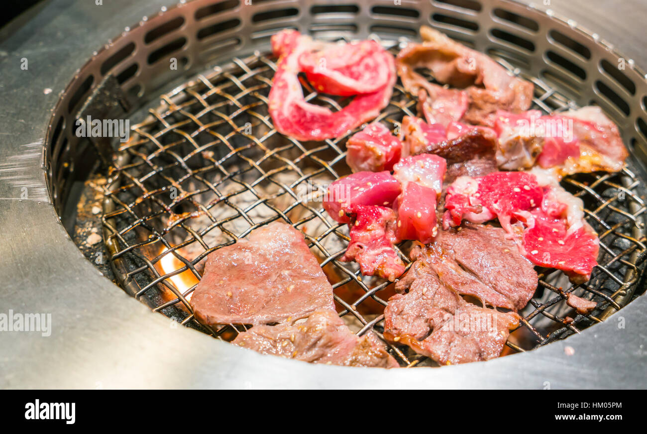 Japanese style Raw fresh beef on hot barbecue grill Stock Photo - Alamy