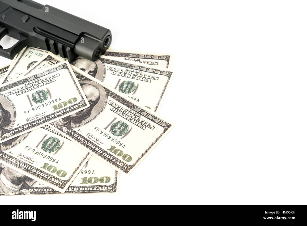 Close up image of pistol and dollar Stock Photo - Alamy