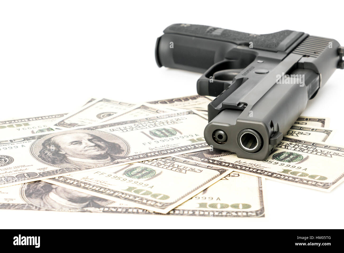 Close up image of pistol and dollar Stock Photo - Alamy