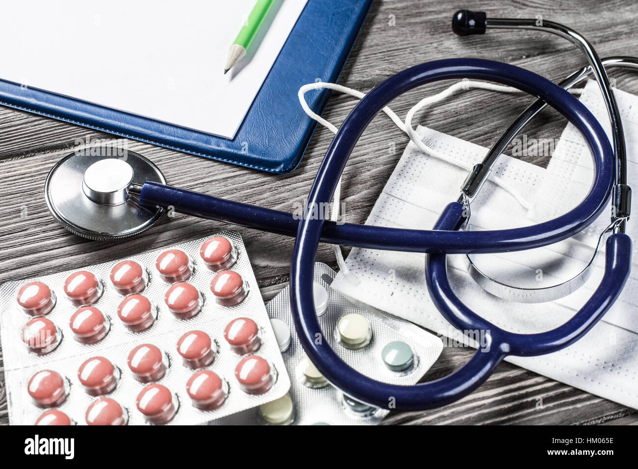 Desk of doctor with medicine things Stock Photo - Alamy
