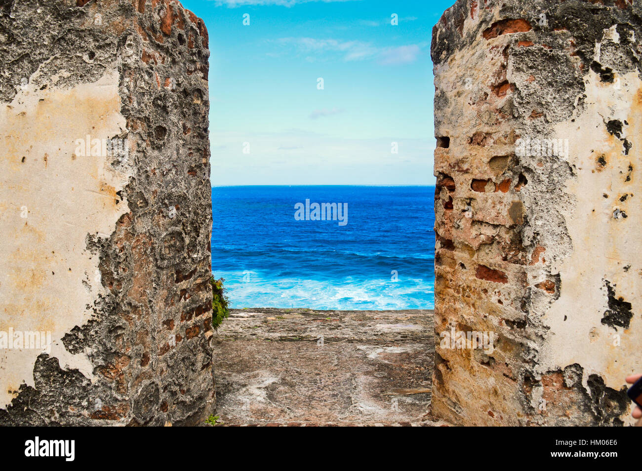 Old Stone walls framing blue ocean and sky Stock Photo - Alamy