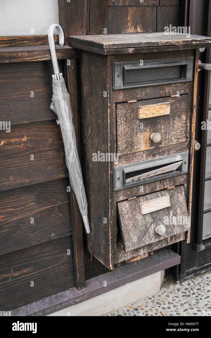 Old wooden mailbox on wood background Stock Photo - Alamy