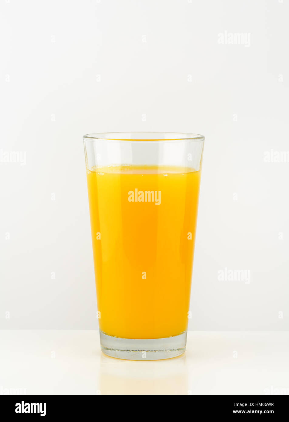 glass of orange juice on white background Stock Photo - Alamy