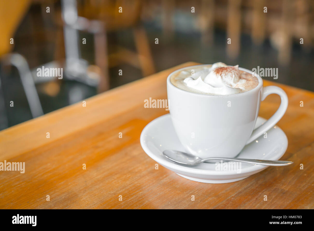 Coffee cup on table in cafe Stock Photo - Alamy