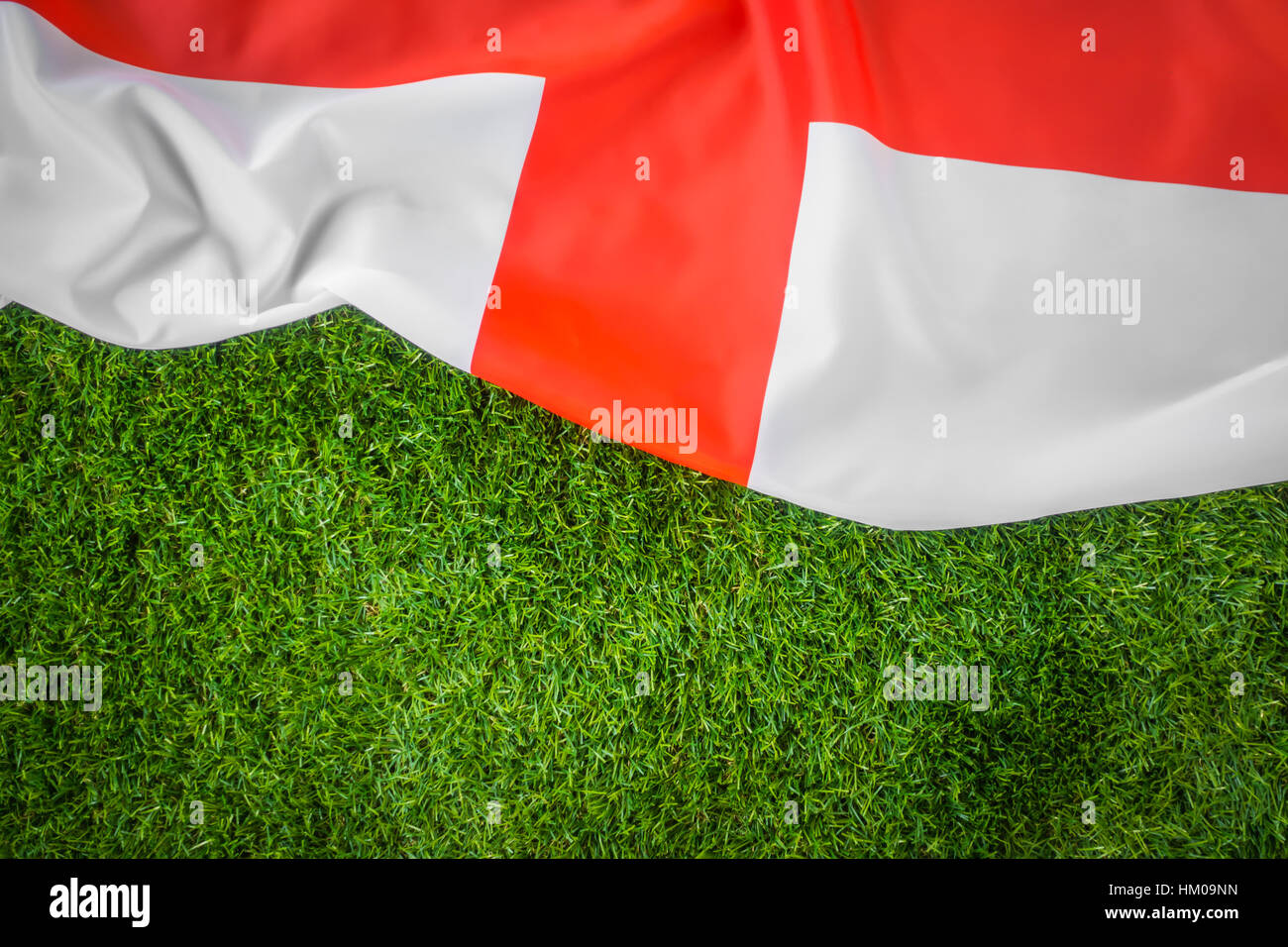 Flags of England on green grass Stock Photo - Alamy