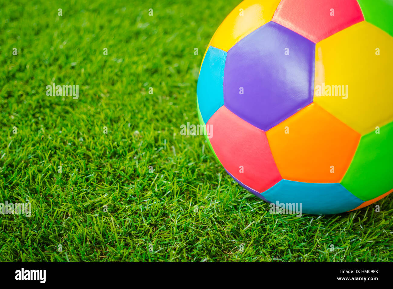 Real leather Colorful multi colour Soccer ball on green grass Stock ...