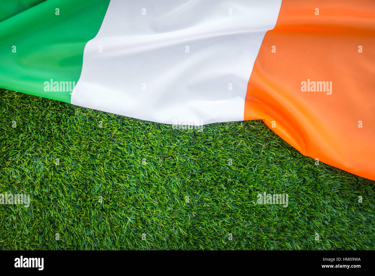 Flags of Republic of Ireland on green grass Stock Photo - Alamy