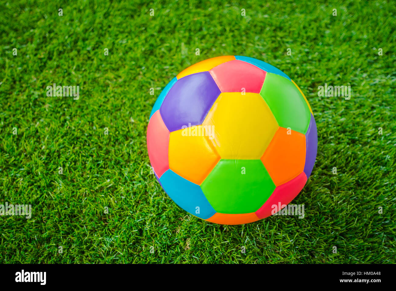 Real leather Colorful multi colour Soccer ball on green grass Stock ...