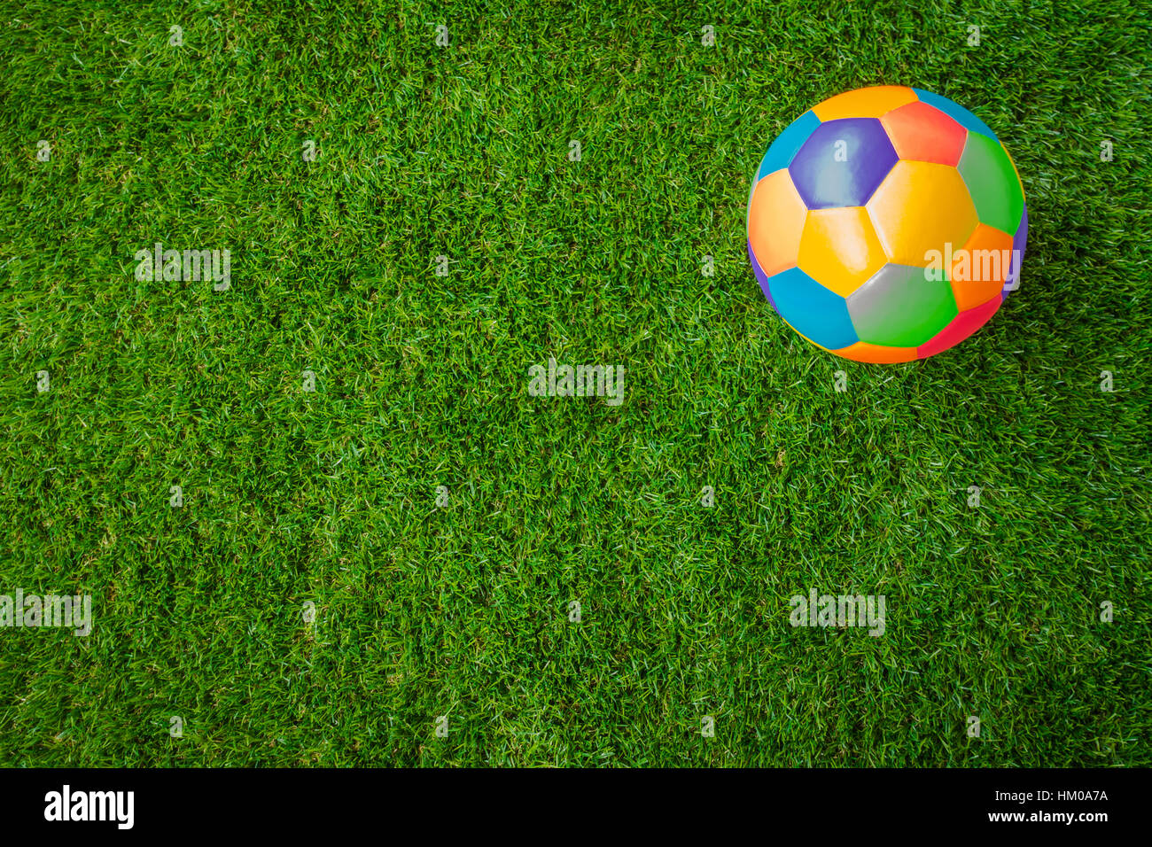 Real leather Colorful multi colour Soccer ball on green grass Stock ...