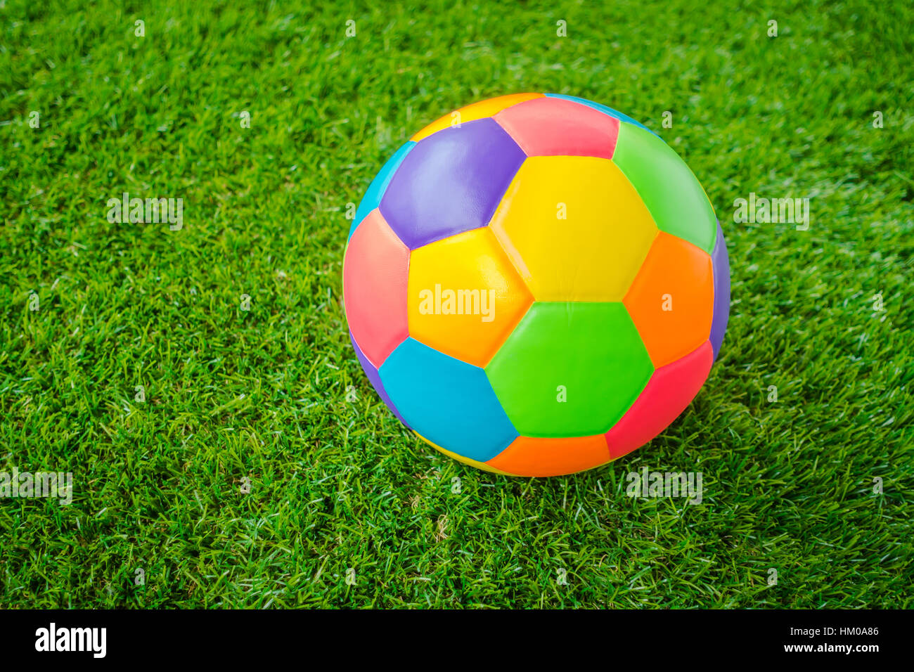 Real leather Colorful multi colour Soccer ball on green grass Stock ...